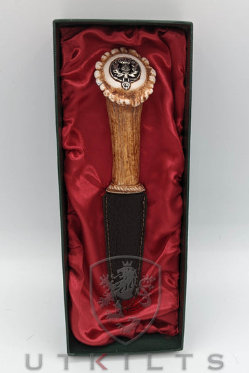 Sgian dubh with a smooth ivory effect handle. A refined Highland knife ...